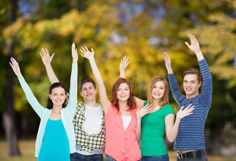 Group of Smiling Students Waving Hands Stock Image - Image of hands ...