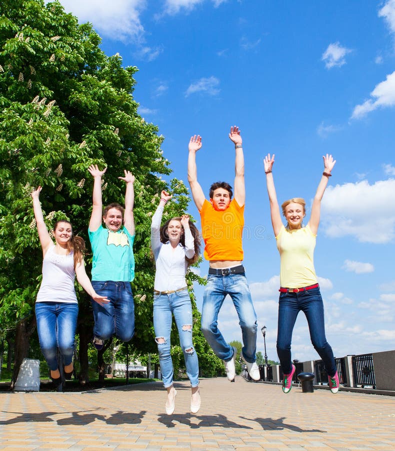 College Students Jumping in the Park Stock Photo - Image of team ...