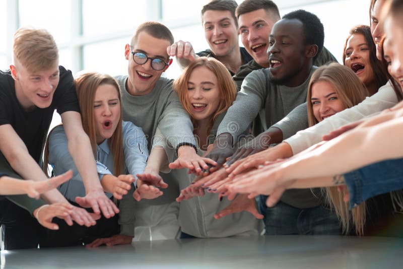 Group of Smiling Young People Joining Their Hands Stock Photo - Image ...