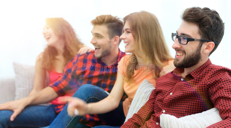Group of Smiling Young People Sitting on the Couch Stock Photo - Image ...