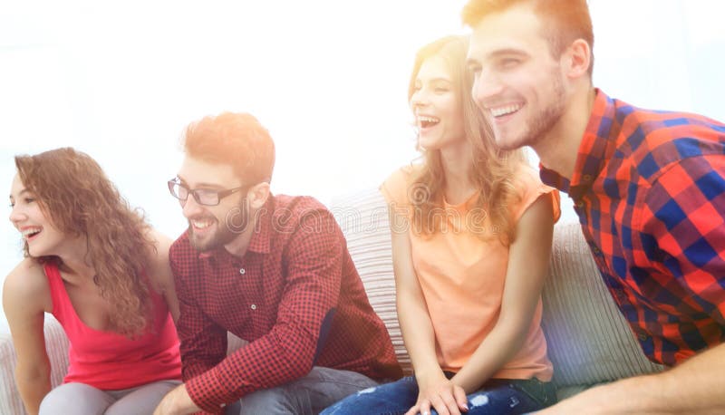 Group of Smiling Young People Sitting on the Couch Stock Photo - Image ...