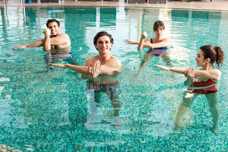 Of Smiling Young People Training Together Stock Photo - Image of ...