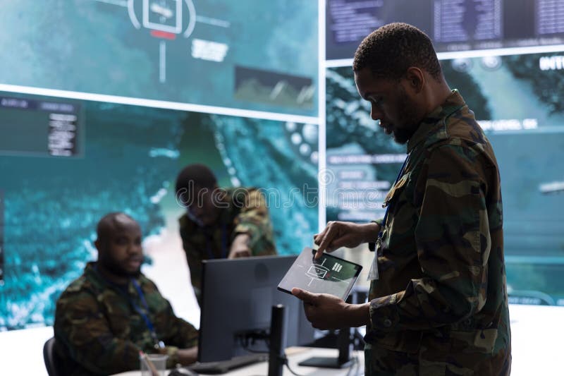 Group of Soldiers in a Secure Office Environment Collaborates on ...