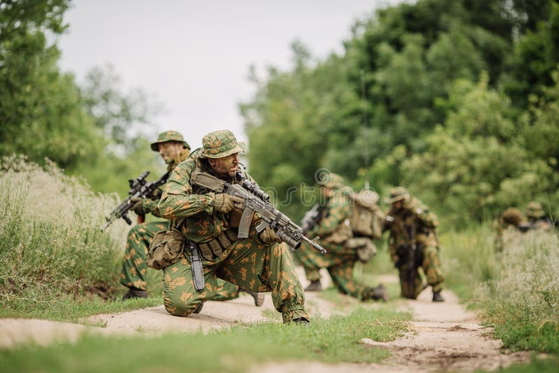 Group of Soldiers Special Forces during the Raid in the Forest Stock ...