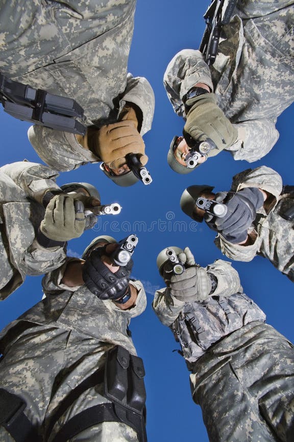Group of Soldiers Standing in Circle Aiming Stock Photo - Image of ...
