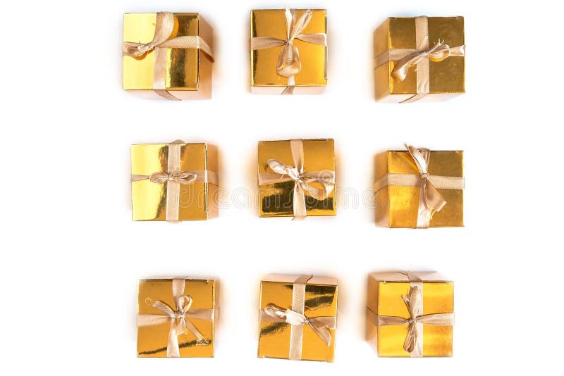 Group of Sparkling Gold Present or Gift Boxes in a Row with Bow ...