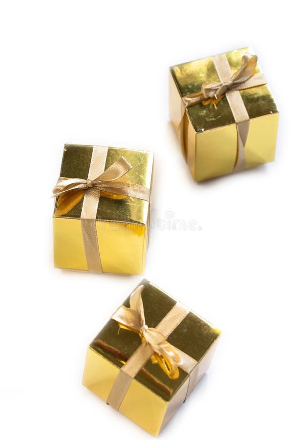 Group of Sparkling Gold Present or Gift Boxes in a Row with Bow ...