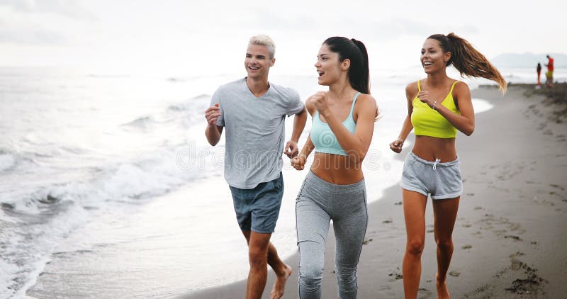 Happy Friends with Drinks Toasting at Rooftop Party at Night Stock ...