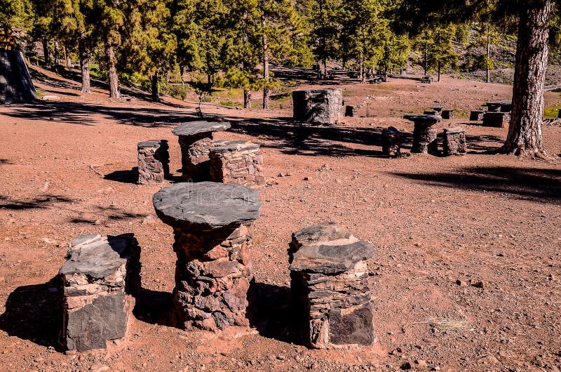 A Group of Stone Benches are Arranged in a Field Stock Photo - Image of ...