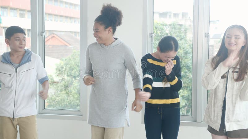 Group of Student Doing Activity To Teacher with Dancing and Movement ...