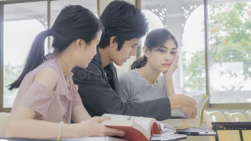 Group Student Read Book and Sit in Classroom Stock Image - Image of ...