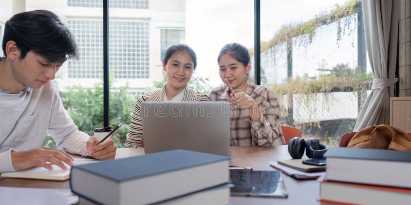 Group of Student Study Together in a Modern Library with Laptops and ...
