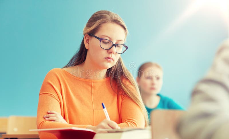 Group of Students with Books Writing School Test Stock Photo - Image of ...