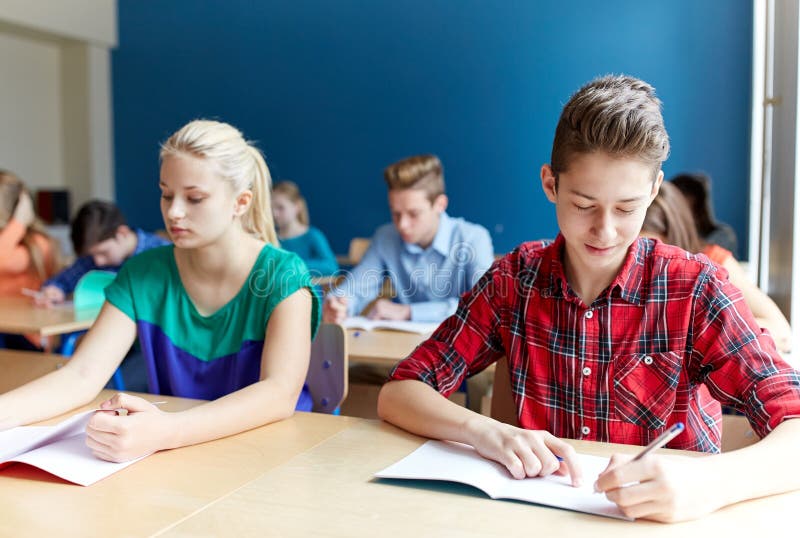 Group of Students with Books Writing School Test Stock Photo - Image of ...