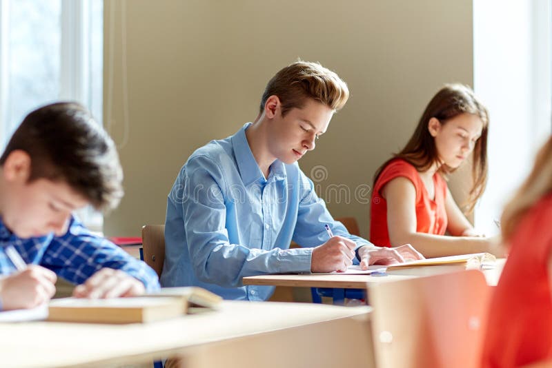 Group of Students with Books Writing School Test Stock Photo - Image of ...