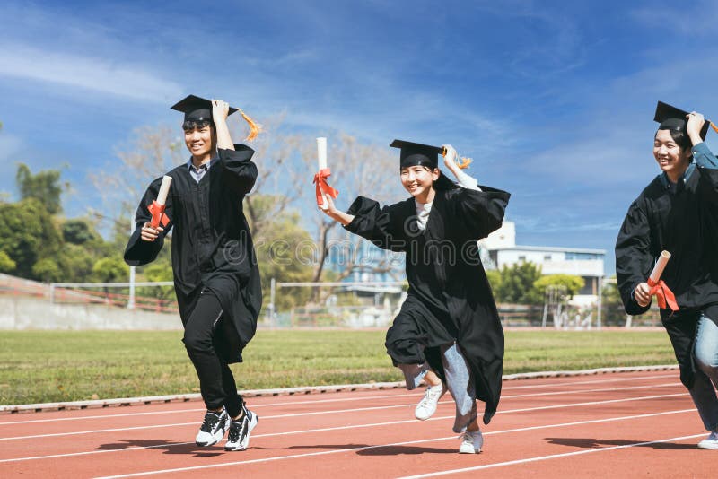 Group of Students Celebrating Graduation and Running on the Track Stock ...