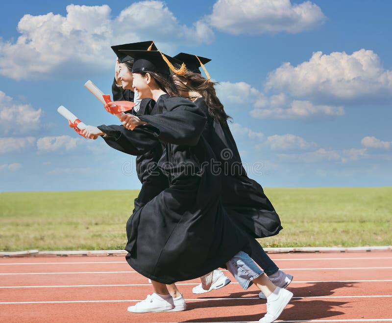 Group of Students Celebrating Graduation and Running on the Track Stock ...