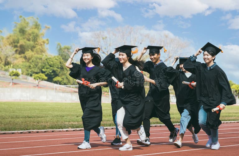 Group of Students Celebrating Graduation and Running on the Track Stock ...