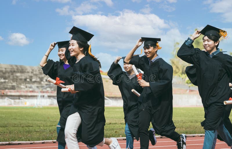 Students Celebrating Graduation Watching the Sunli Stock Image - Image ...