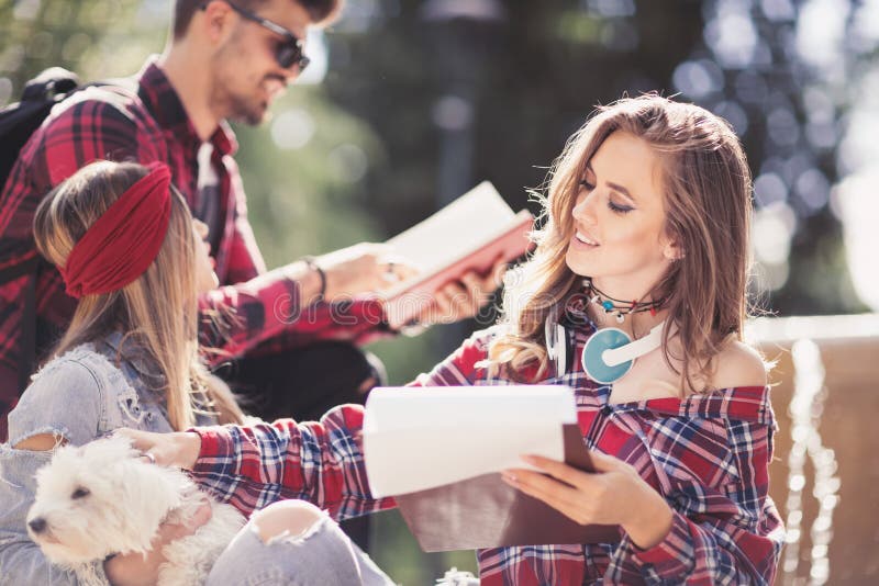 Group of Students Chatting Together Outdoors Stock Image - Image of ...