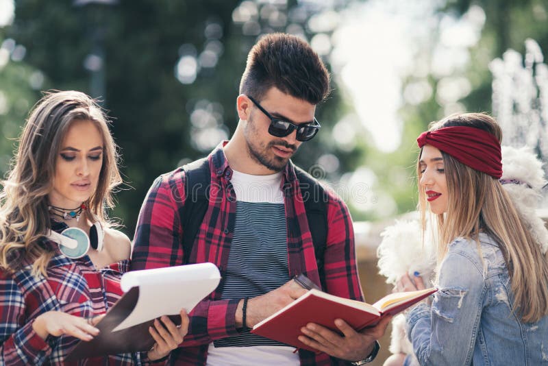 Group of Students Chatting Together Outdoors Stock Image - Image of ...
