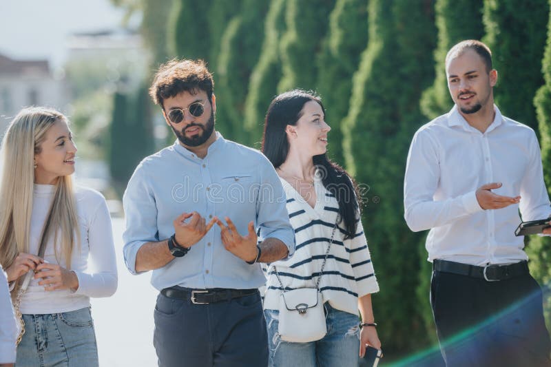 Group of Students Collaborating Outdoors in a Park for Successful ...