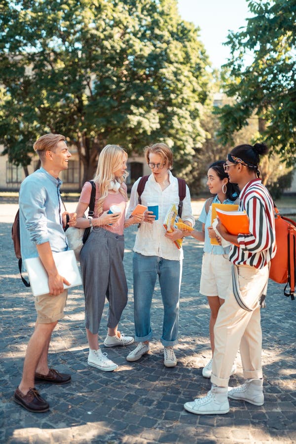Group of Students Deciding Where To Go Next. Stock Image - Image of ...
