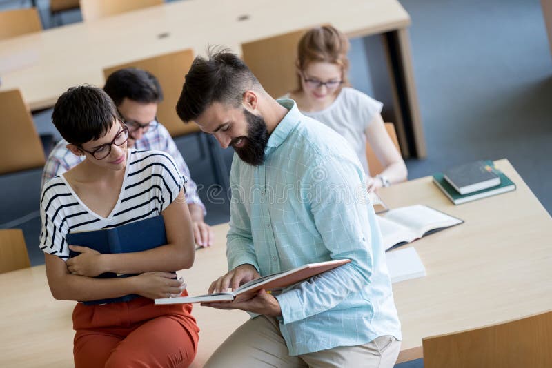 Group of Students Discussing in University Stock Image - Image of ...
