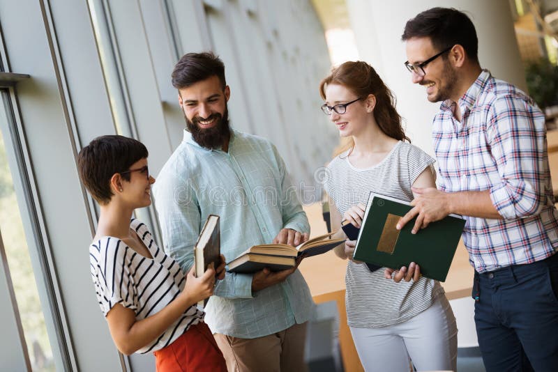 Group of Students Discussing in University Stock Photo - Image of ...