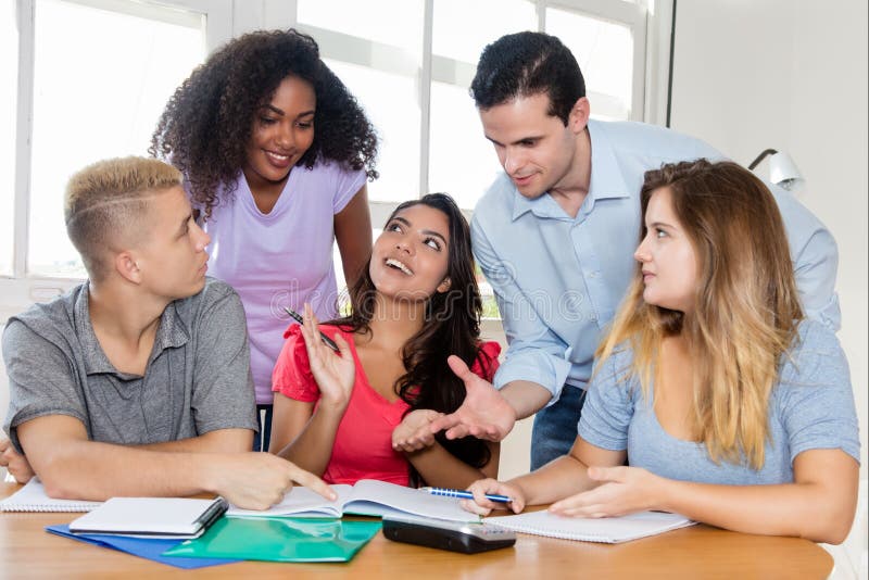 Group of Students in Discussion with Teacher at University Stock Photo ...