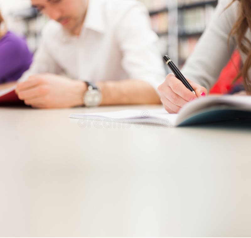 Young Students Writing Notes in Classroom Stock Image - Image of ...