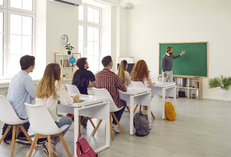 Group of Students Enthusiastically and Attentively Listens To Professor ...
