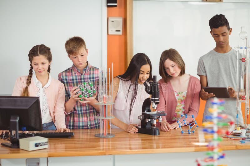 Group of Students Experimenting Molecule Model in Laboratory Stock ...