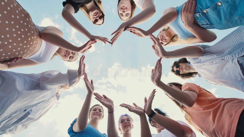 Students Joining Hands in a Circle, Symbolizing Teamwork and ...