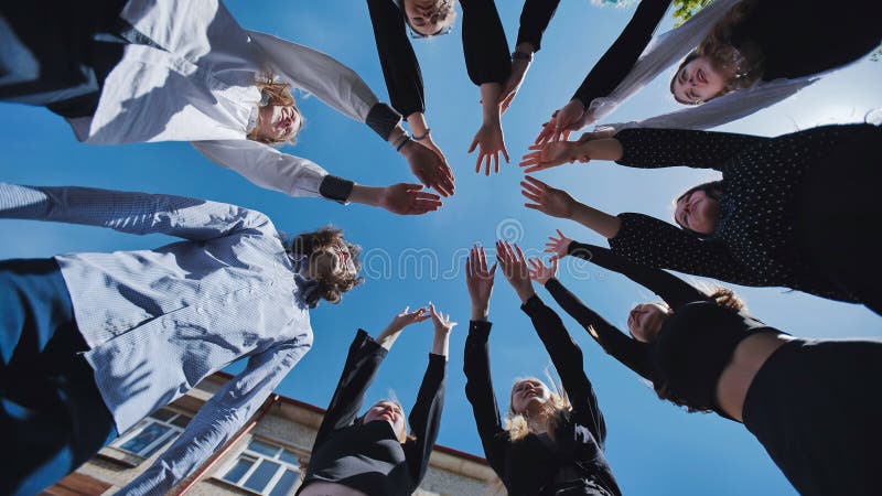 Students Joining Hands in a Circle, Celebrating Their School Day with ...