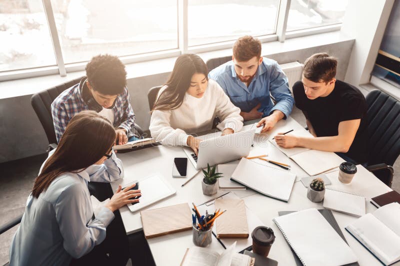 Group of Students with Gadgets and Books Doing Homework in Library ...