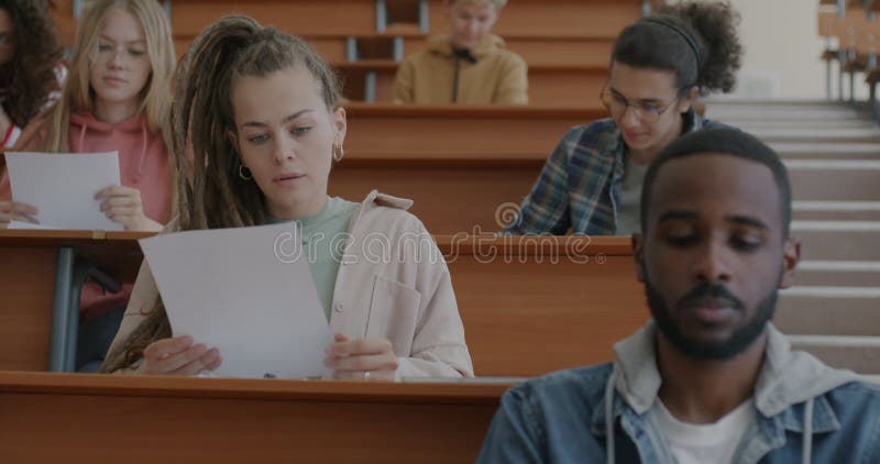 Diverse Group of Business People Talking and Using Laptop during ...