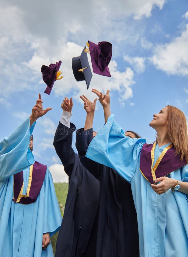 Group of Students in Graduation Gowns and Caps Stock Photo - Image of ...