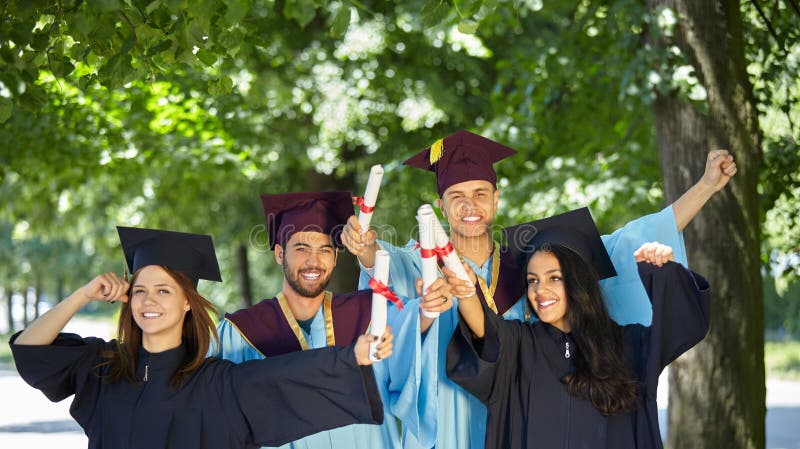 Group of Students in Graduation Gowns and Caps Stock Image - Image of ...
