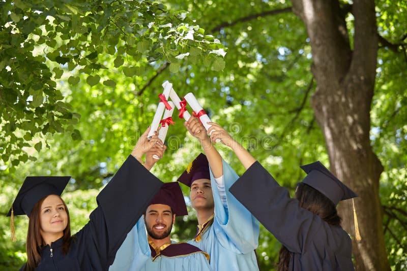 Graduation Day for a Group of Multiracial Graduates Students Posing ...