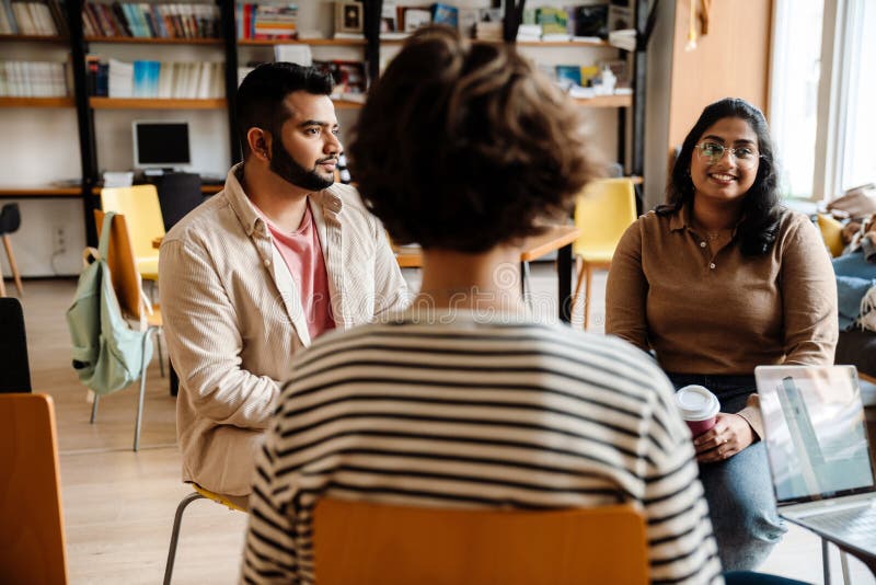 Group of Students Having Discussion while Working on University Project ...