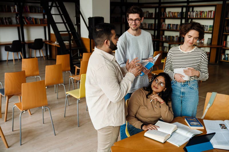 Group of Students Having Discussion while Working on University Project ...
