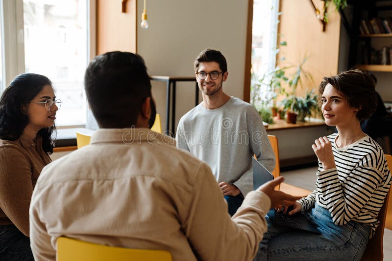 Group of Students Having Discussion while Working on University Project ...