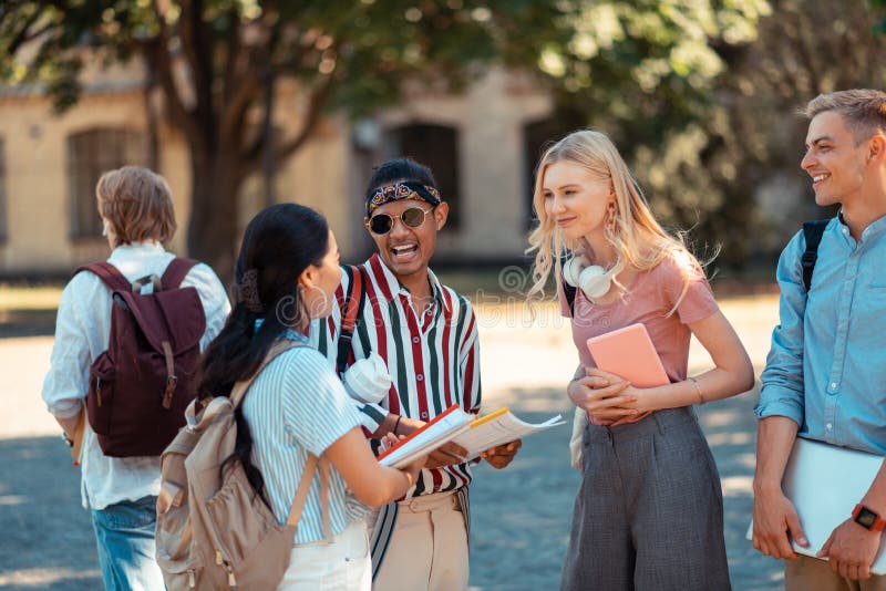 Group of Students Joking in the University Yard. Stock Photo - Image of ...