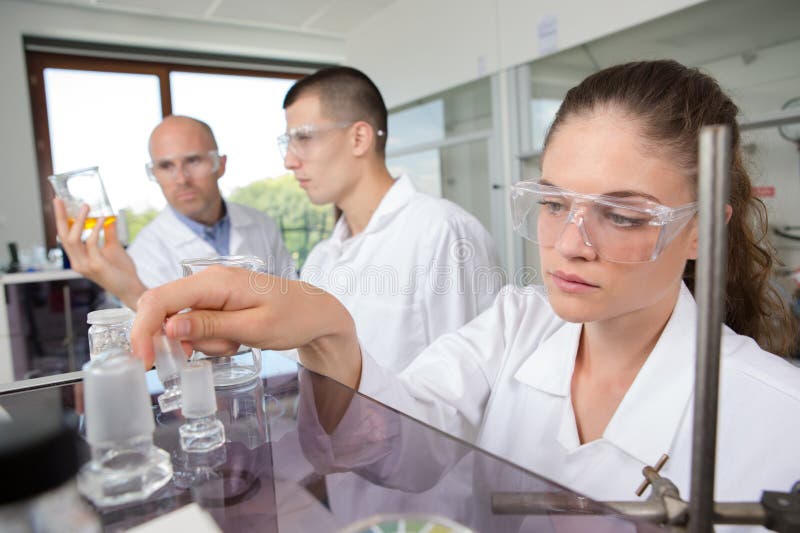 Group students in lab stock image. Image of experiment - 277791967
