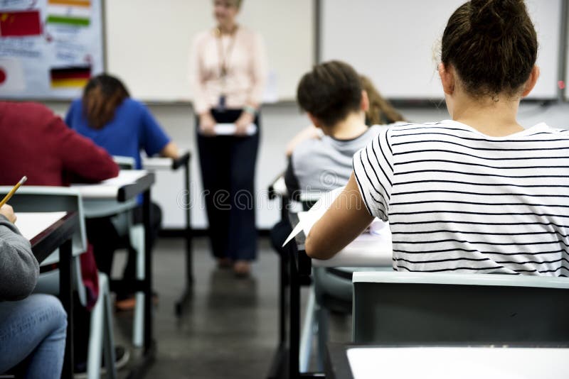 Group of Students Learning in Classroom Stock Photo - Image of teacher ...