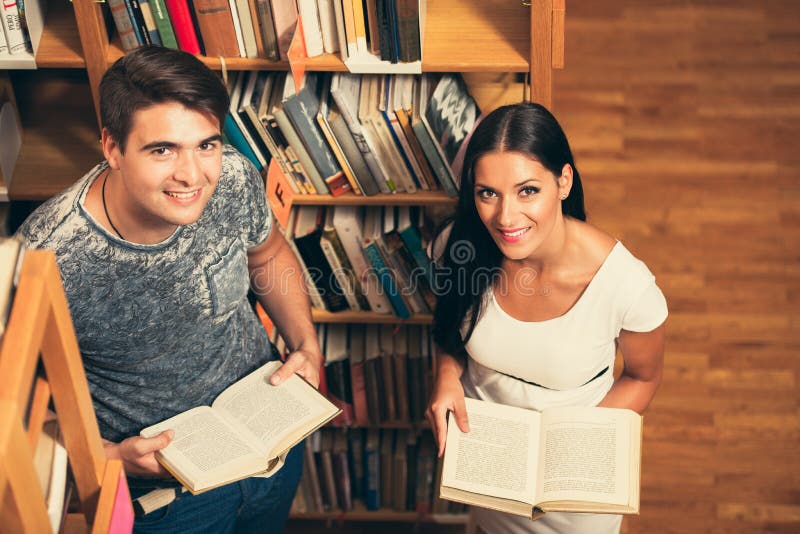 Group of Students in Library Reading Books - Study Group Stock Photo ...