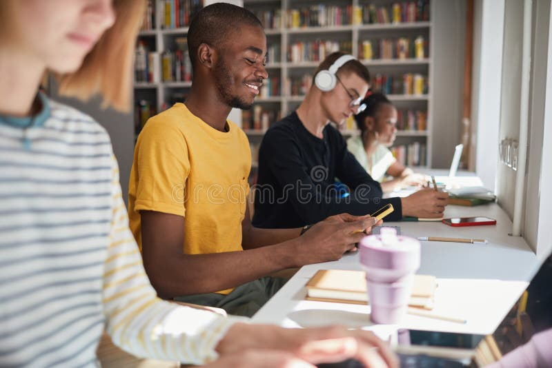 Group of Students in Library Side View Stock Photo - Image of young ...