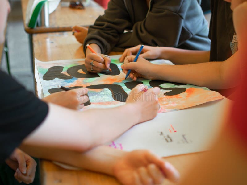 Group of Students Making a Text Banner in Their Class Stock Photo ...