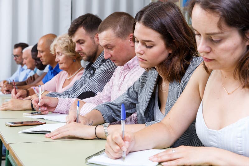 Group Students Listening and Writing Stock Image - Image of conference ...